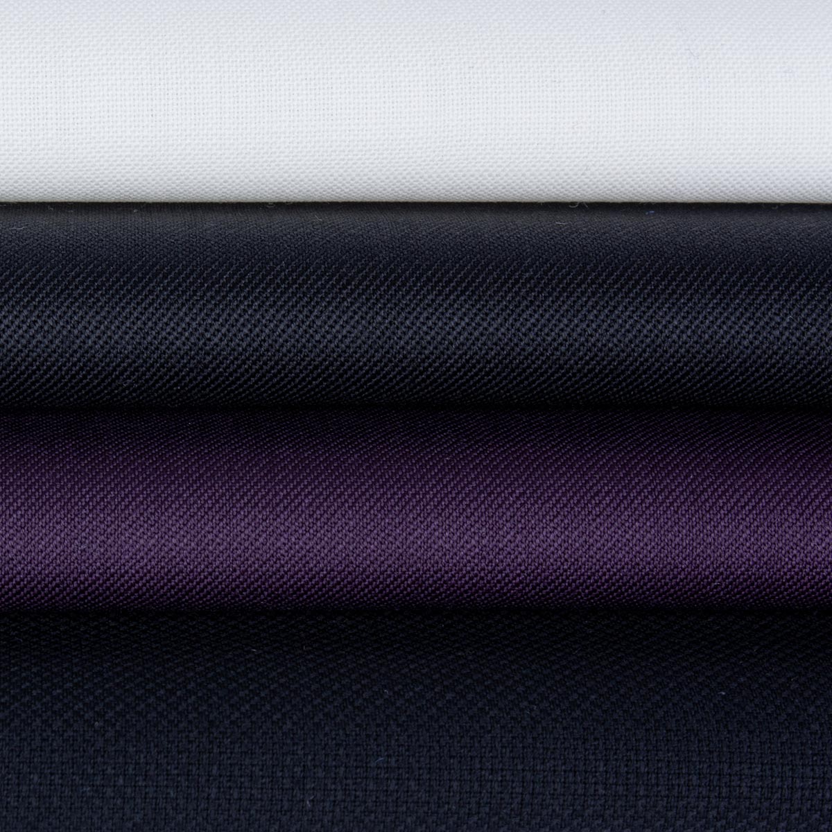 Four samples of GOTS certified woven organic wool